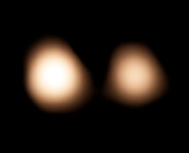 New Horizons sends color image of Pluto, Charon as it nears unexplored ...